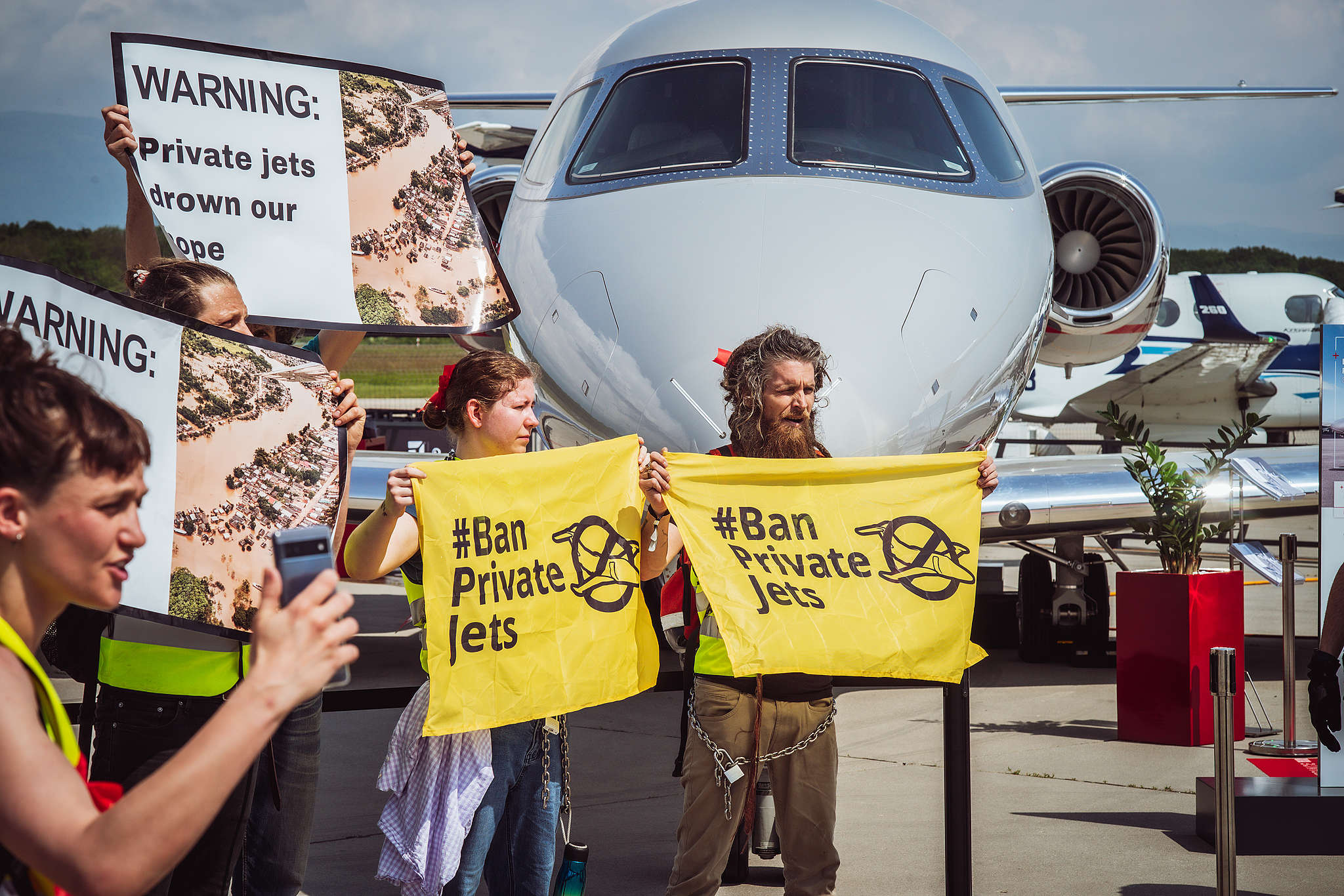 A hundred climate activists block private jets at biggest business ...